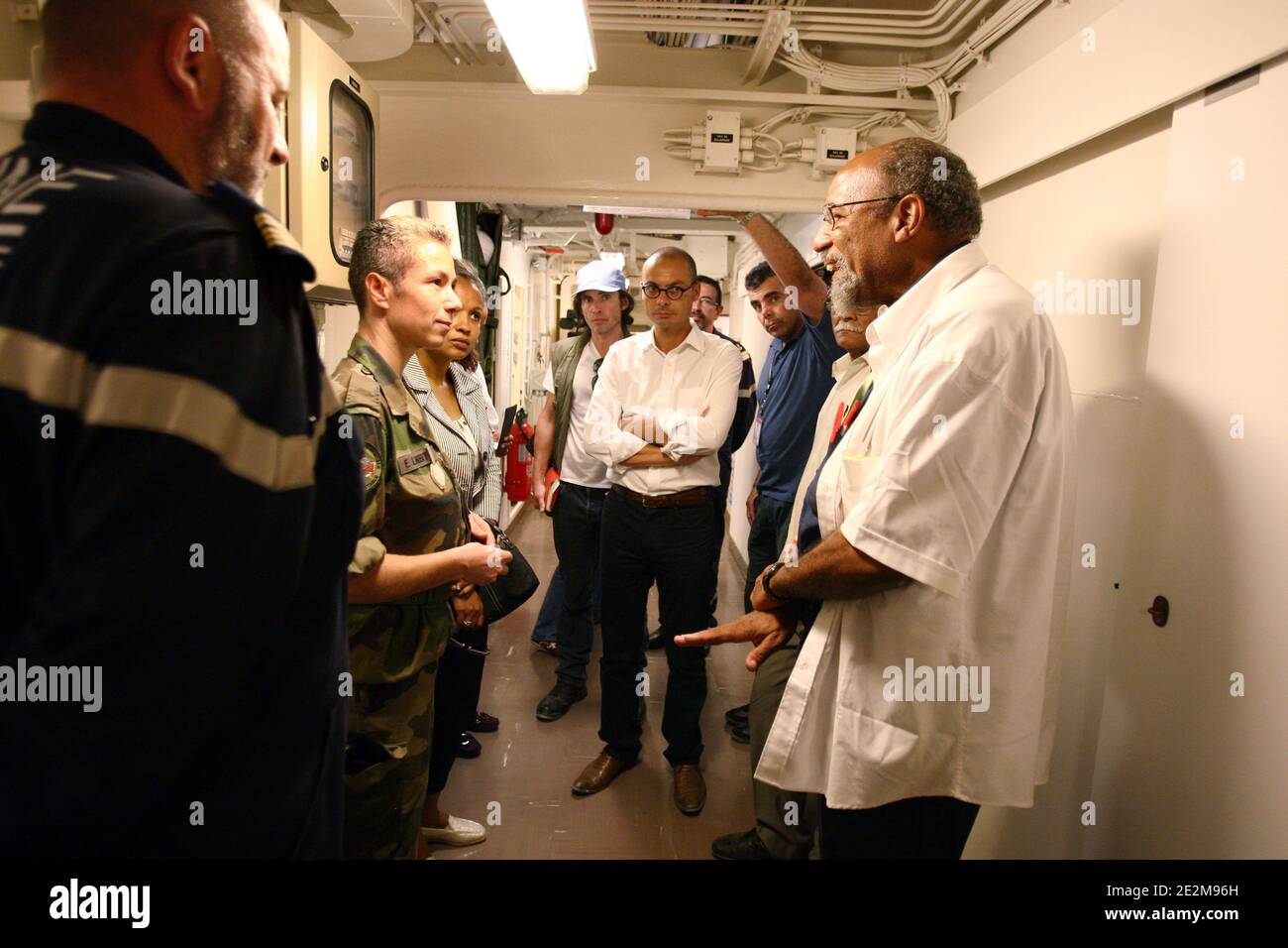 French ambassador to Haiti, Didier Le Bret (C) and Haiti's fist lady ...