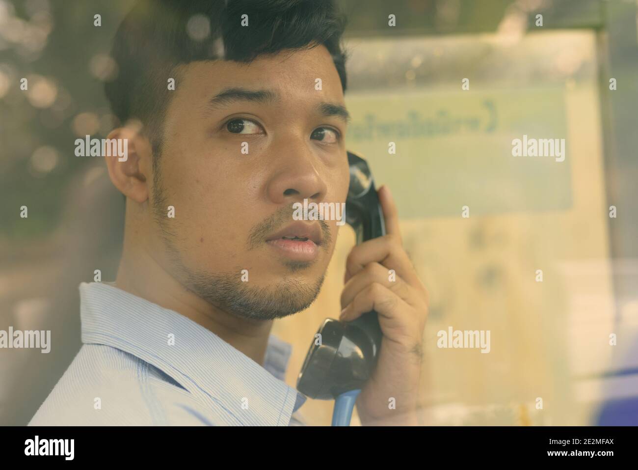 Man using payphone hi-res stock photography and images - Alamy
