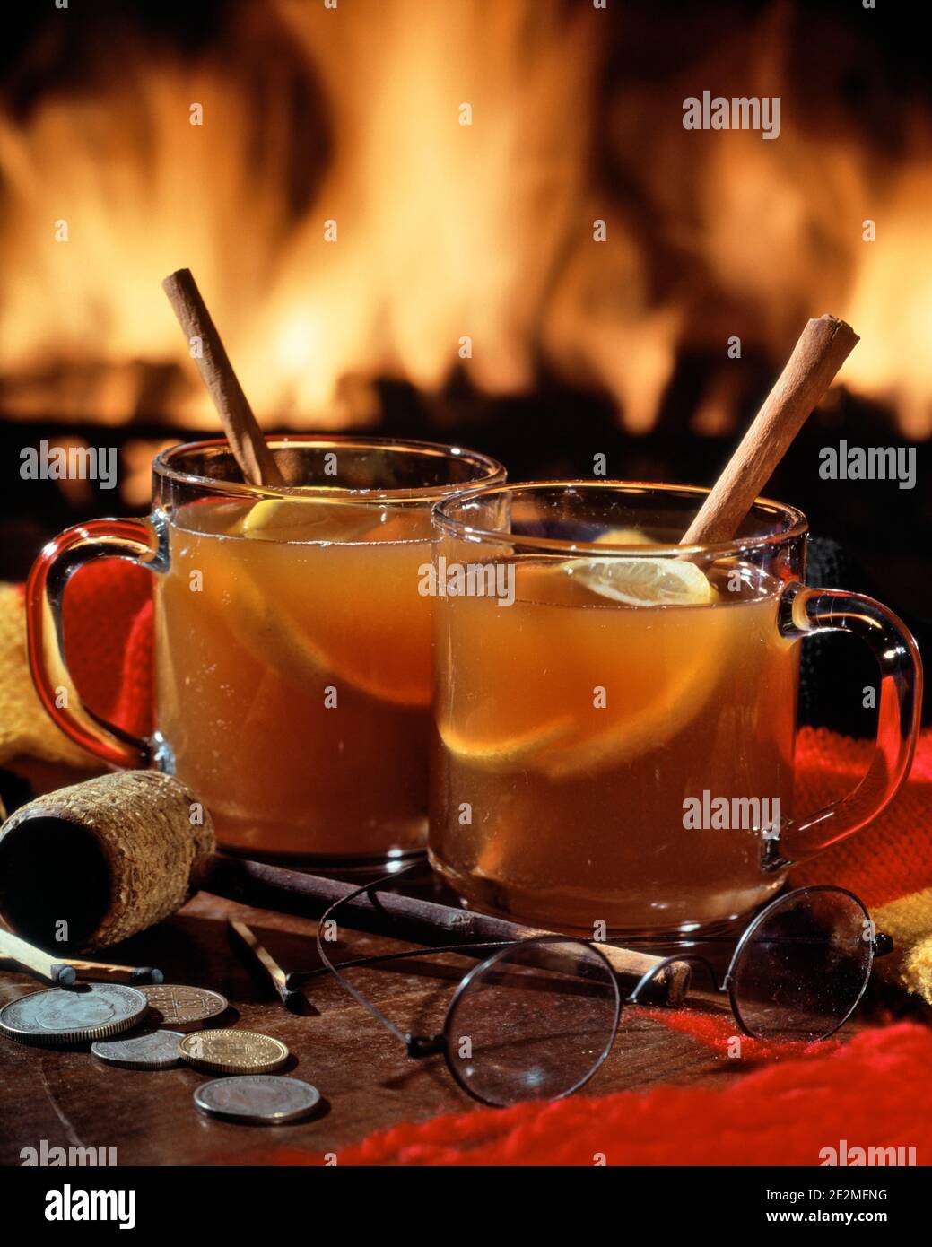 1980s TWO GLASS CUPS OF HOT MULLED APPLE CIDER WITH CINNAMON STICKS A ...