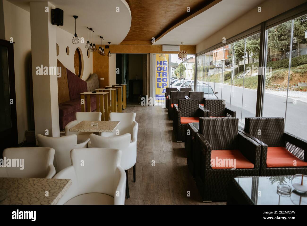 Nice shot of the restaurant with cozy tables by the window Stock Photo ...