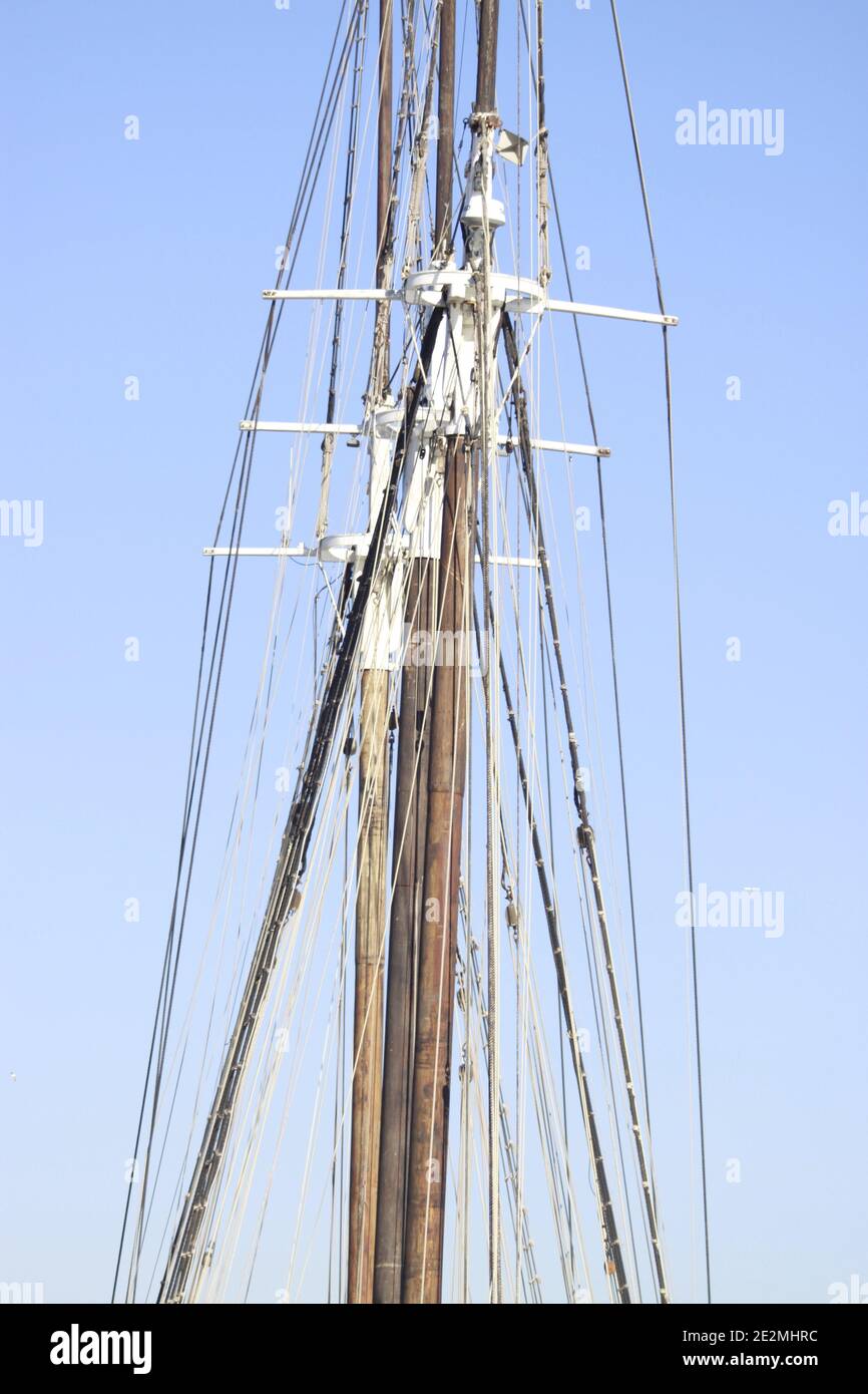 Vertical closeup shot of sailing boat mast and rigging details with a ...