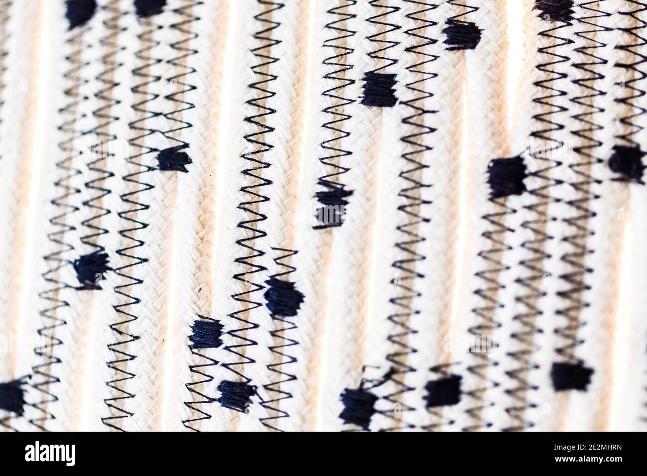Closeup of abstract cream cloth with blue zigzag patterns Stock Photo ...
