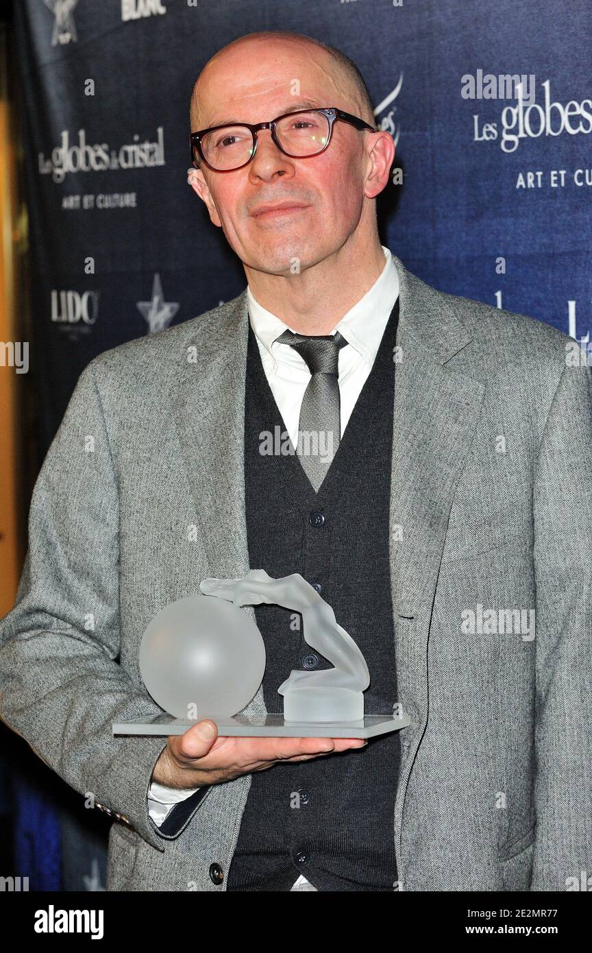 Jacques Audiard poses with his Best Movie Award at the Globes de ...