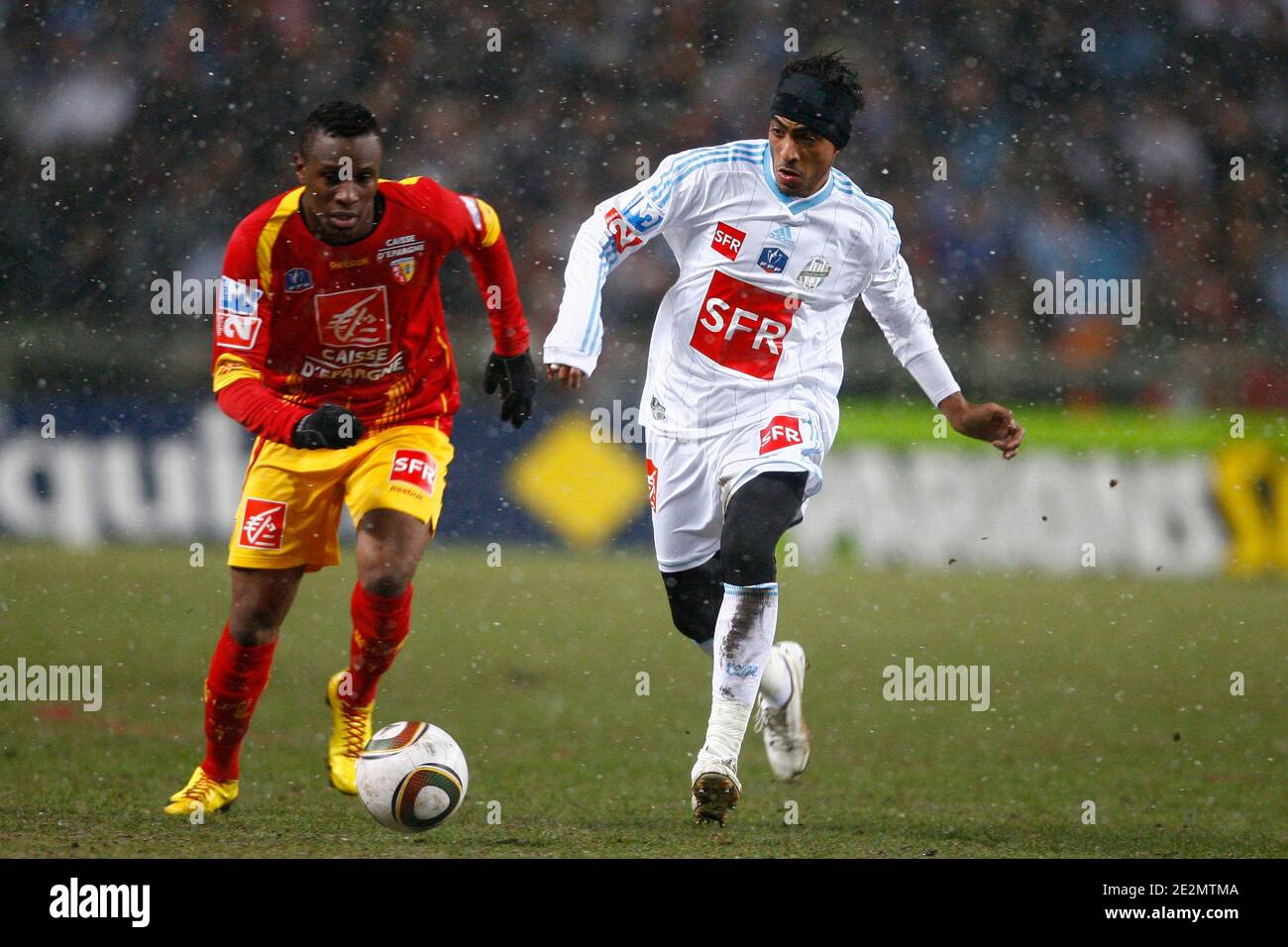 Lens' Samba Sow fights for the ball with Marseille's fabrice Abriel ...