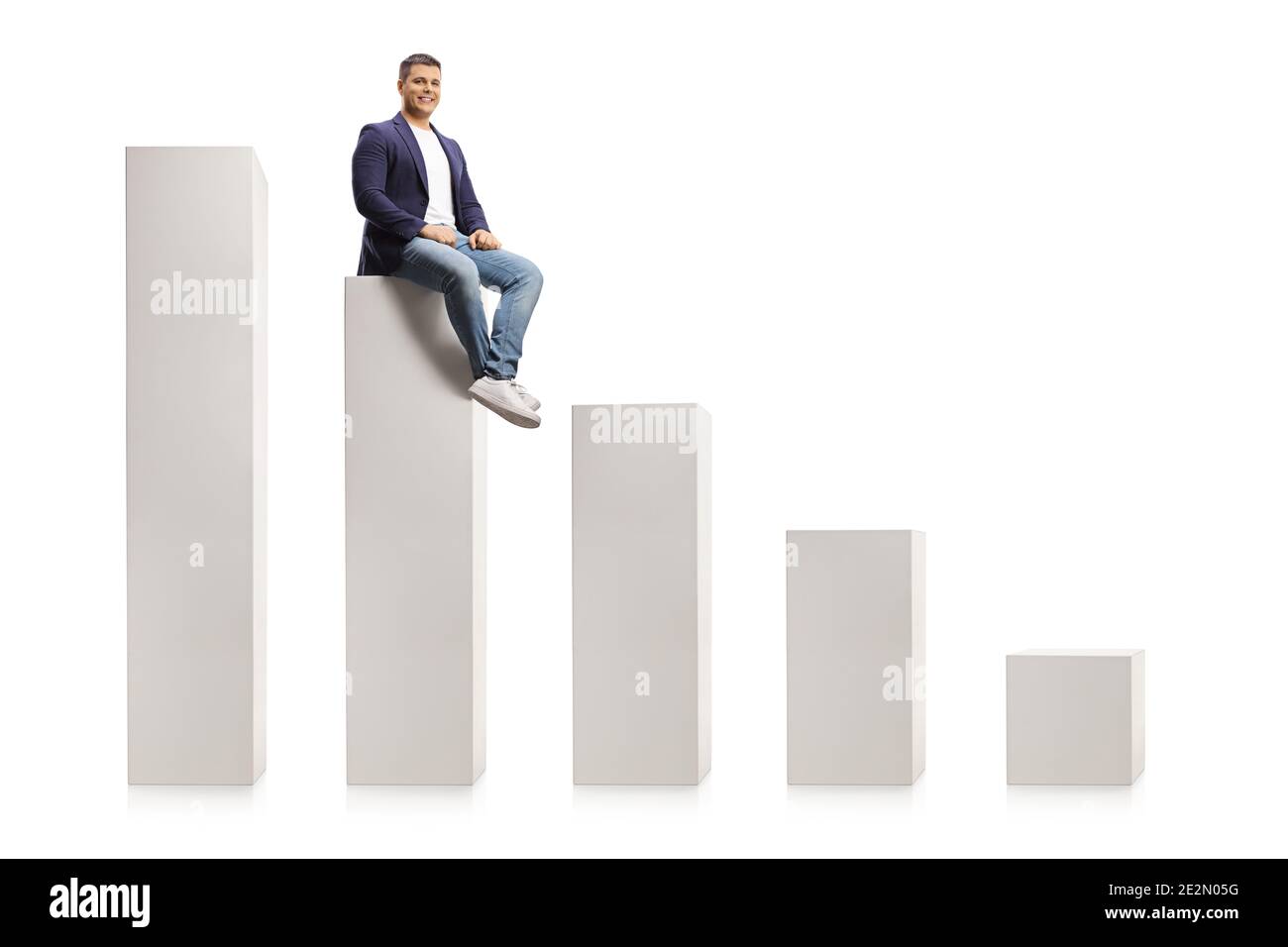 Young man sitting on a chart graph and smiling at camera isolated on ...