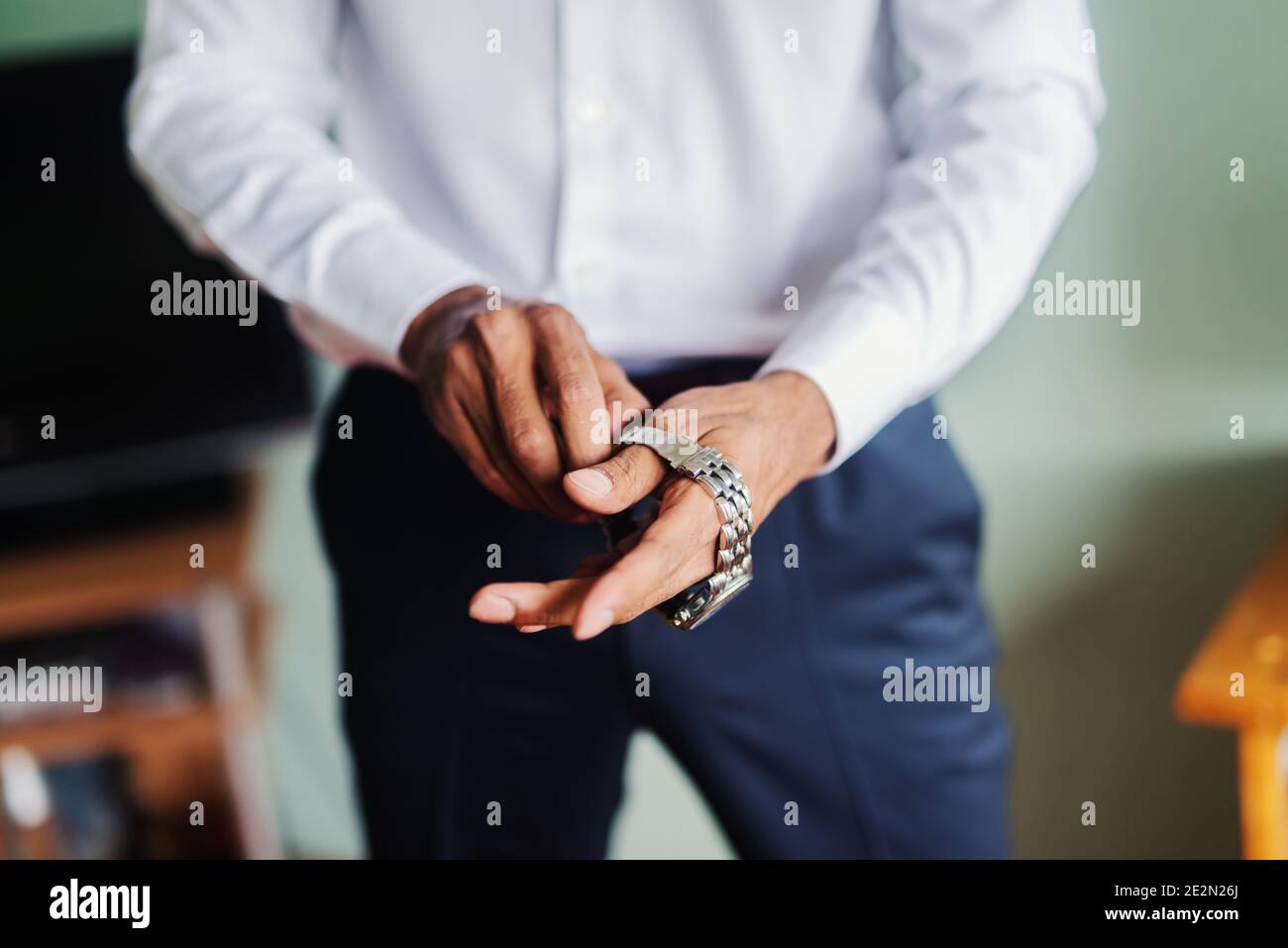 Man putting on watch hi-res stock photography and images - Alamy