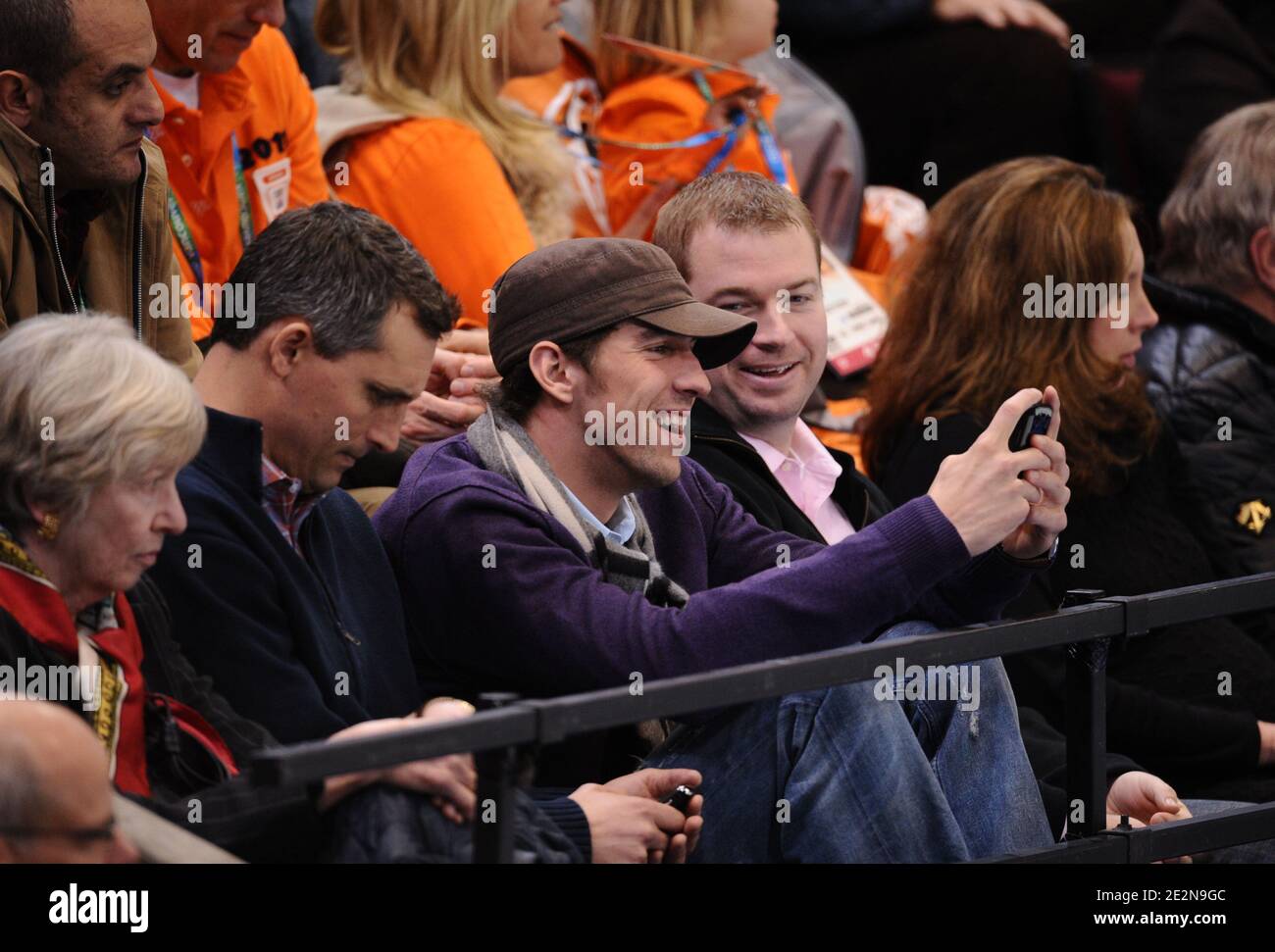 Olympic swimmer champion Michael Phelps watching with friends the short ...