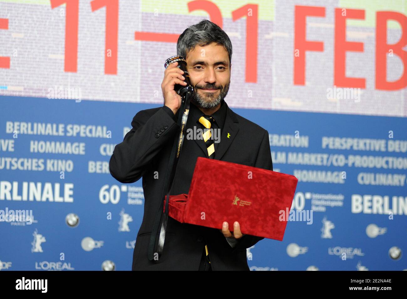 Director Babak Najafi poses with the Best First Feature Award for the ...