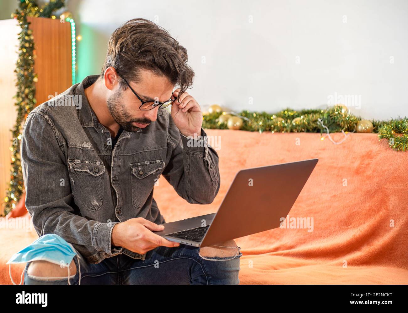 Handsome guy laptop sitting hi-res stock photography and images - Alamy