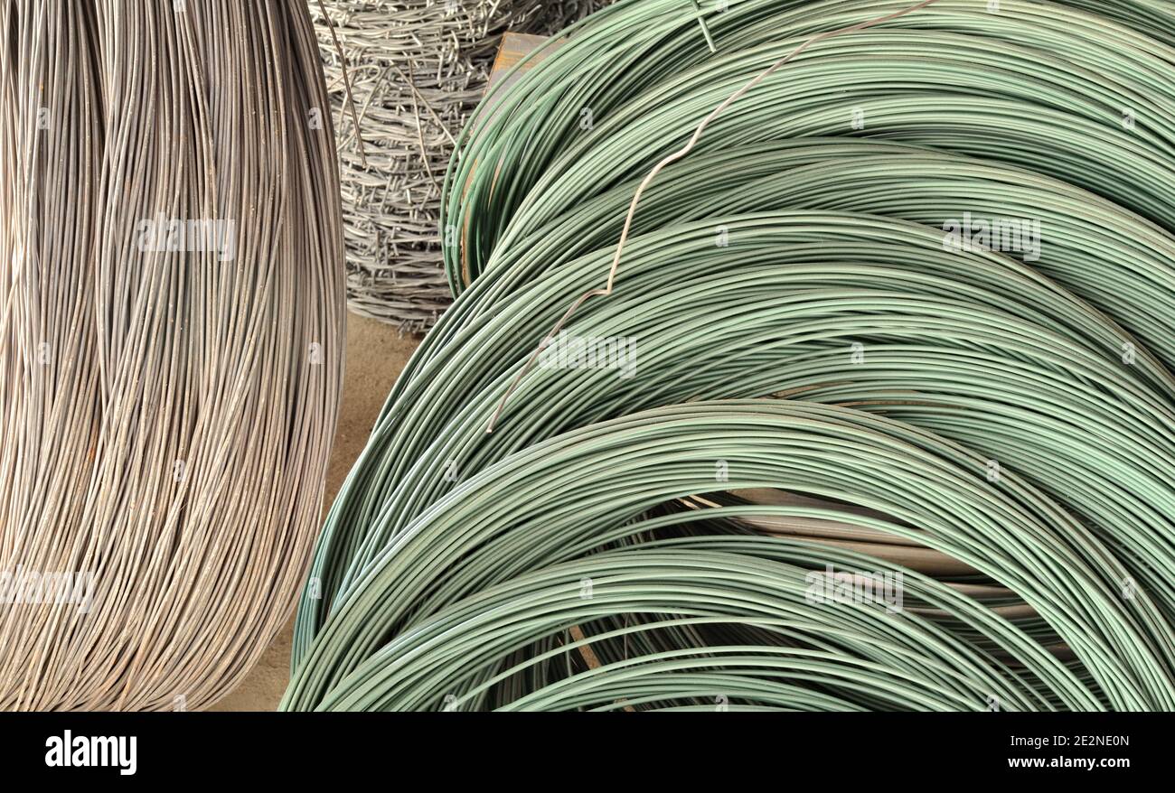 Industry wire roll up in storage. Construction Material - Roll of Metal ...