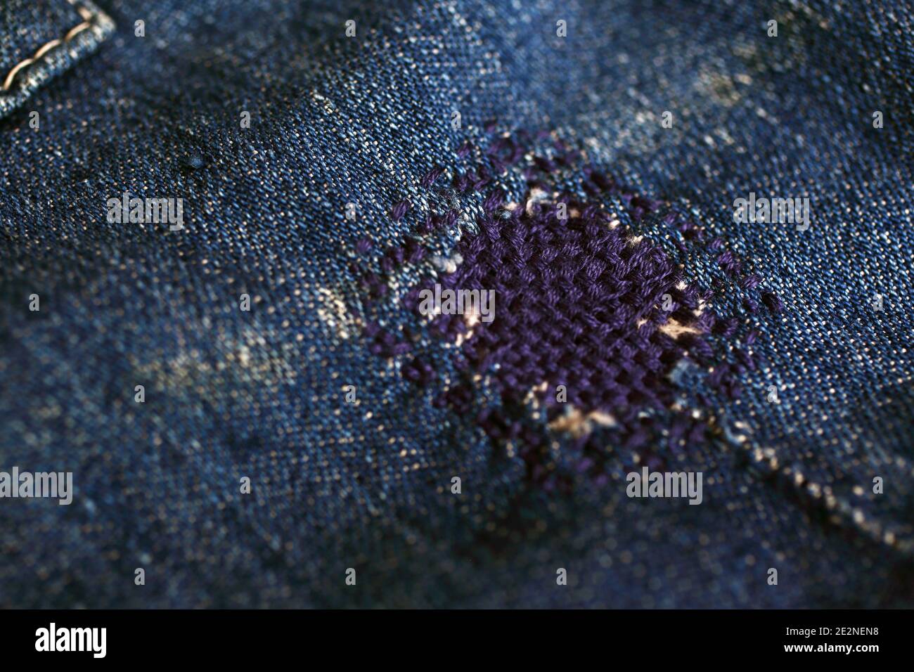 denim jeans detail mended clothing Stock Photo - Alamy