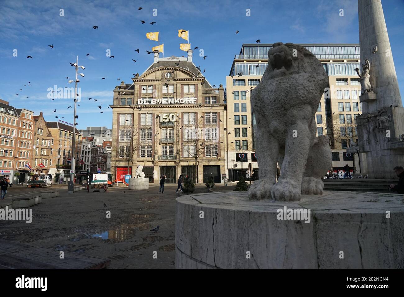 Amsterdam Dam Square on a sunny Monday January Stock Photo - Alamy