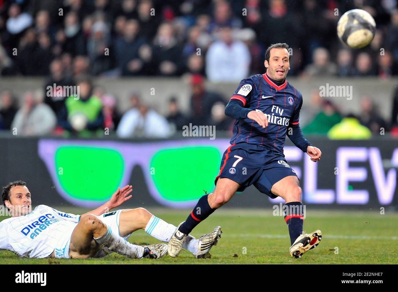 PSG's Ludovic Giuly and Marseille's Laurent Bonnart during French First ...