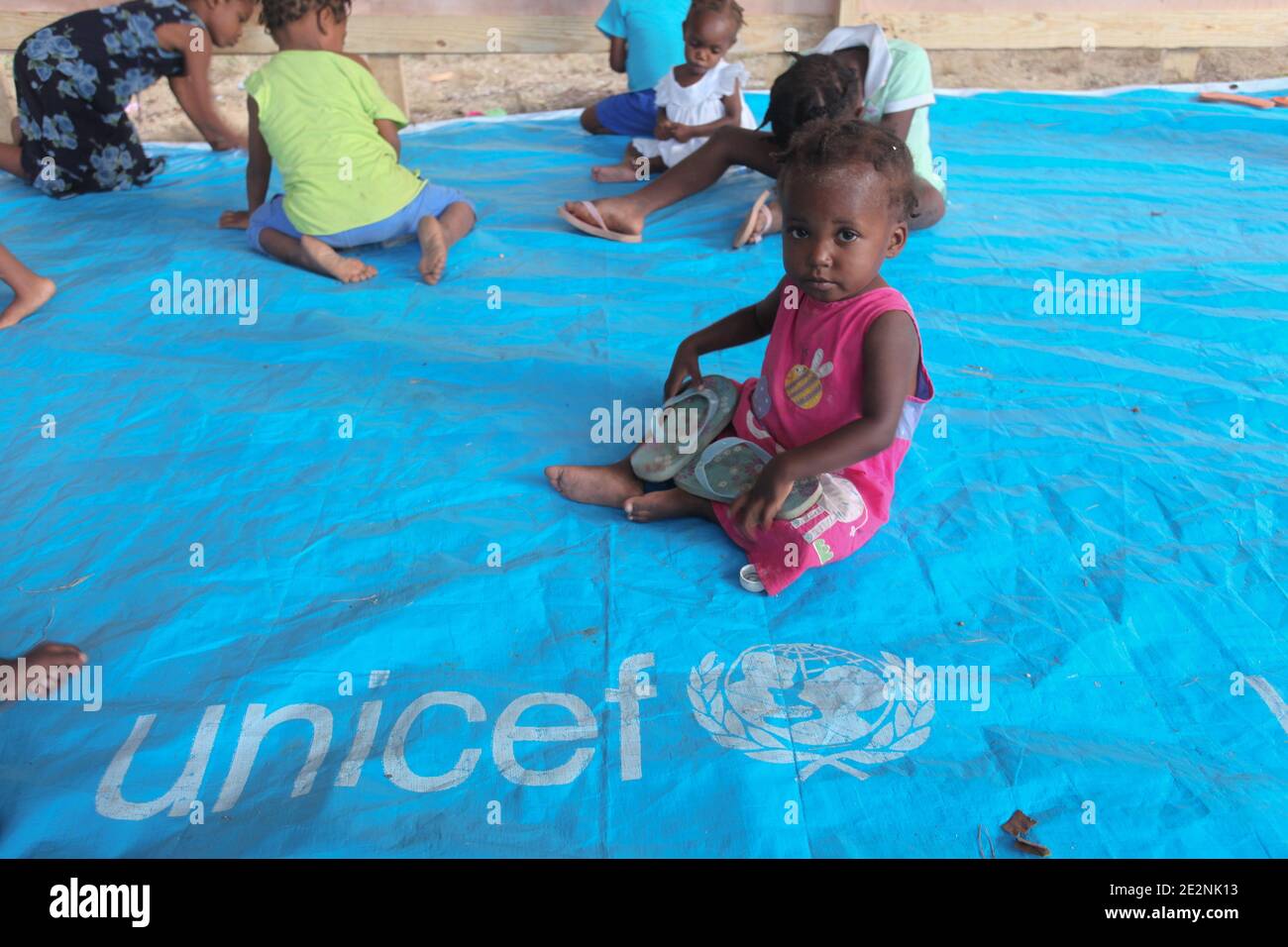 Dada less than 2 sits in a new made shelter by French Protection Civile ...