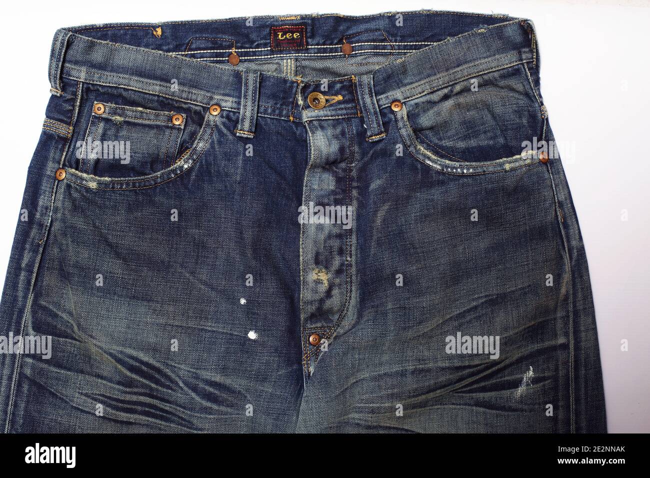 Detail of repair of a pair of denim jeans Stock Photo - Alamy