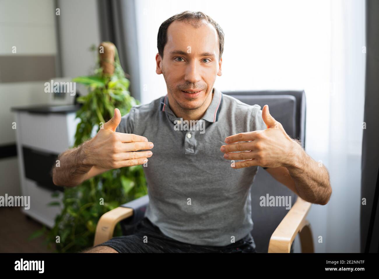 Adult Learning Sign Language For Deaf Disabled Stock Photo - Alamy