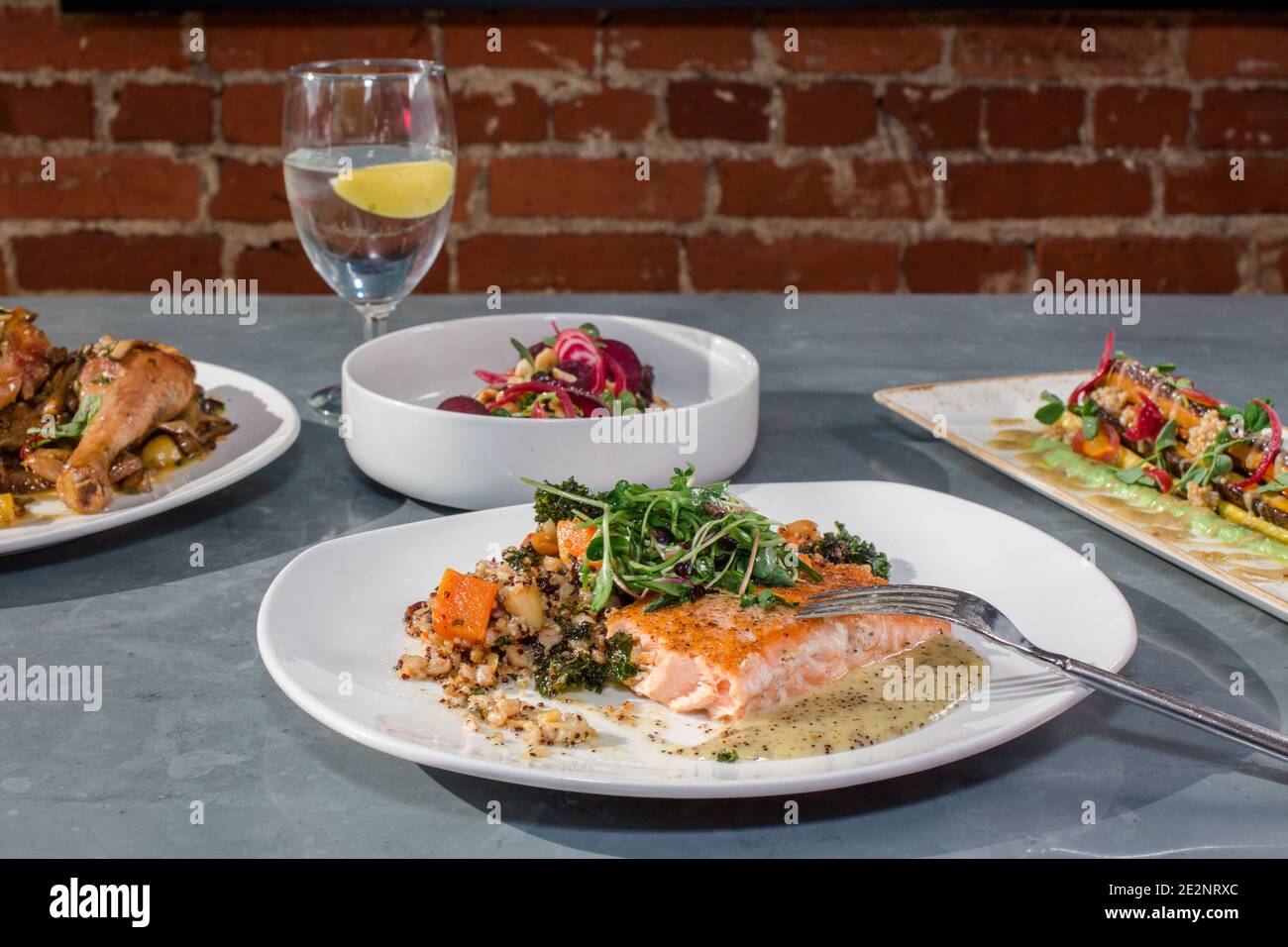 A beautiful feast of colorful food spread out on a restaurant table ...