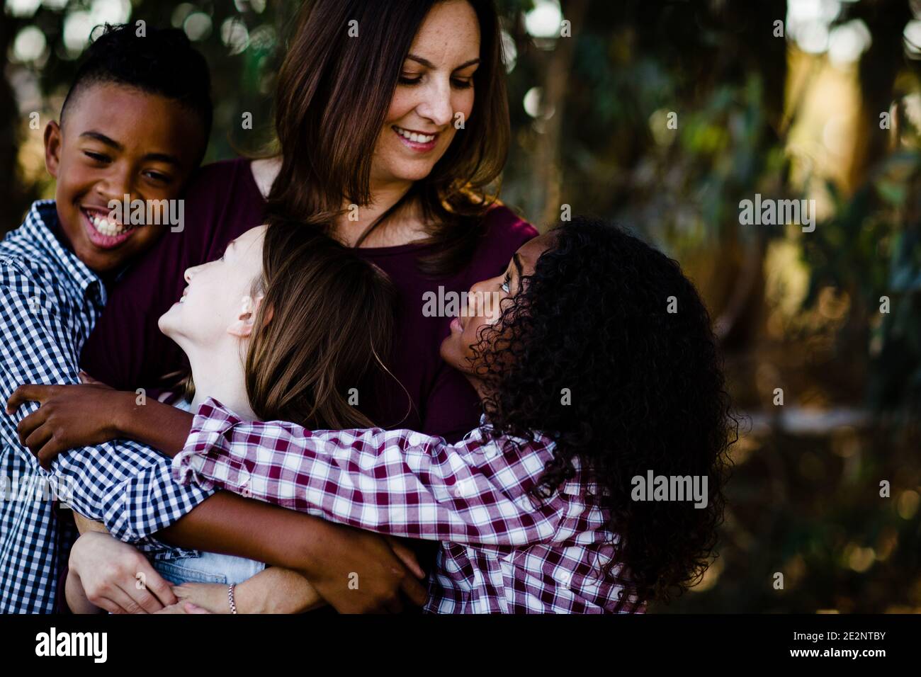 Hispanic family kids hug hi-res stock photography and images - Alamy