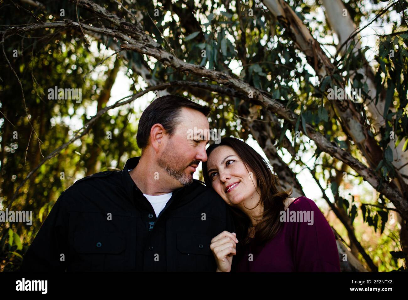 Husband & Wife Posing Under Tree at Park in Chula Vista Stock Photo - Alamy