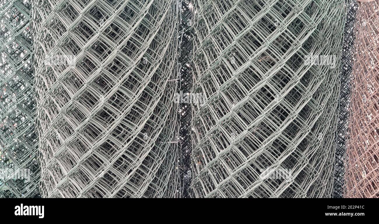 roll of metallic net. Rolls of metal wire fence different heights Stock ...