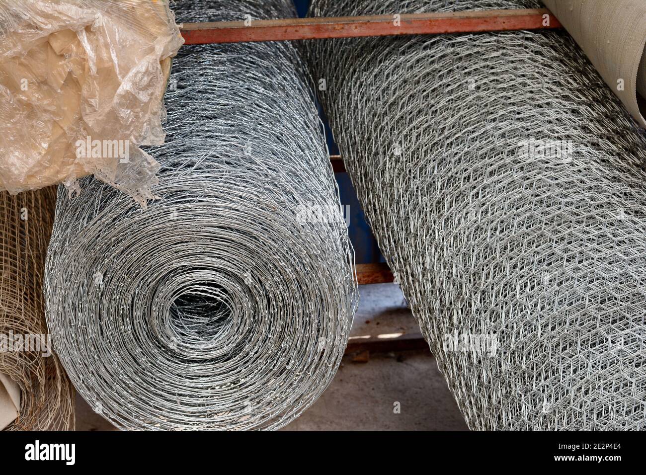 roll of metallic net. Rolls of metal wire fence different heights Stock ...