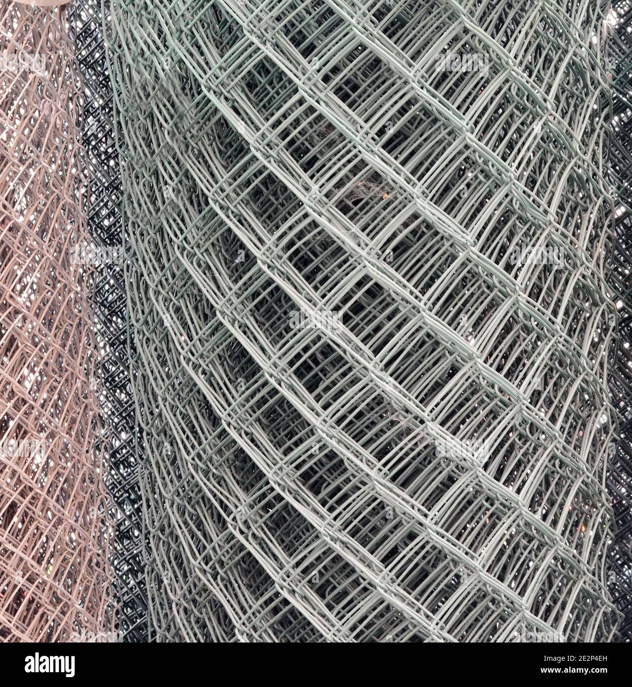 roll of metallic net. Rolls of metal wire fence different heights Stock ...