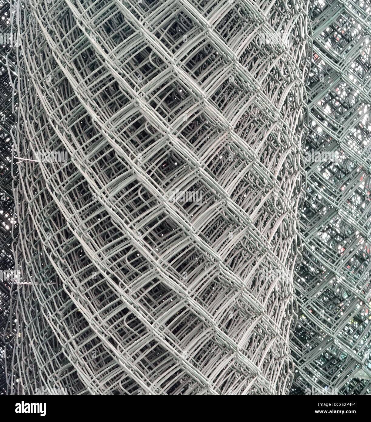 roll of metallic net. Rolls of metal wire fence different heights Stock ...