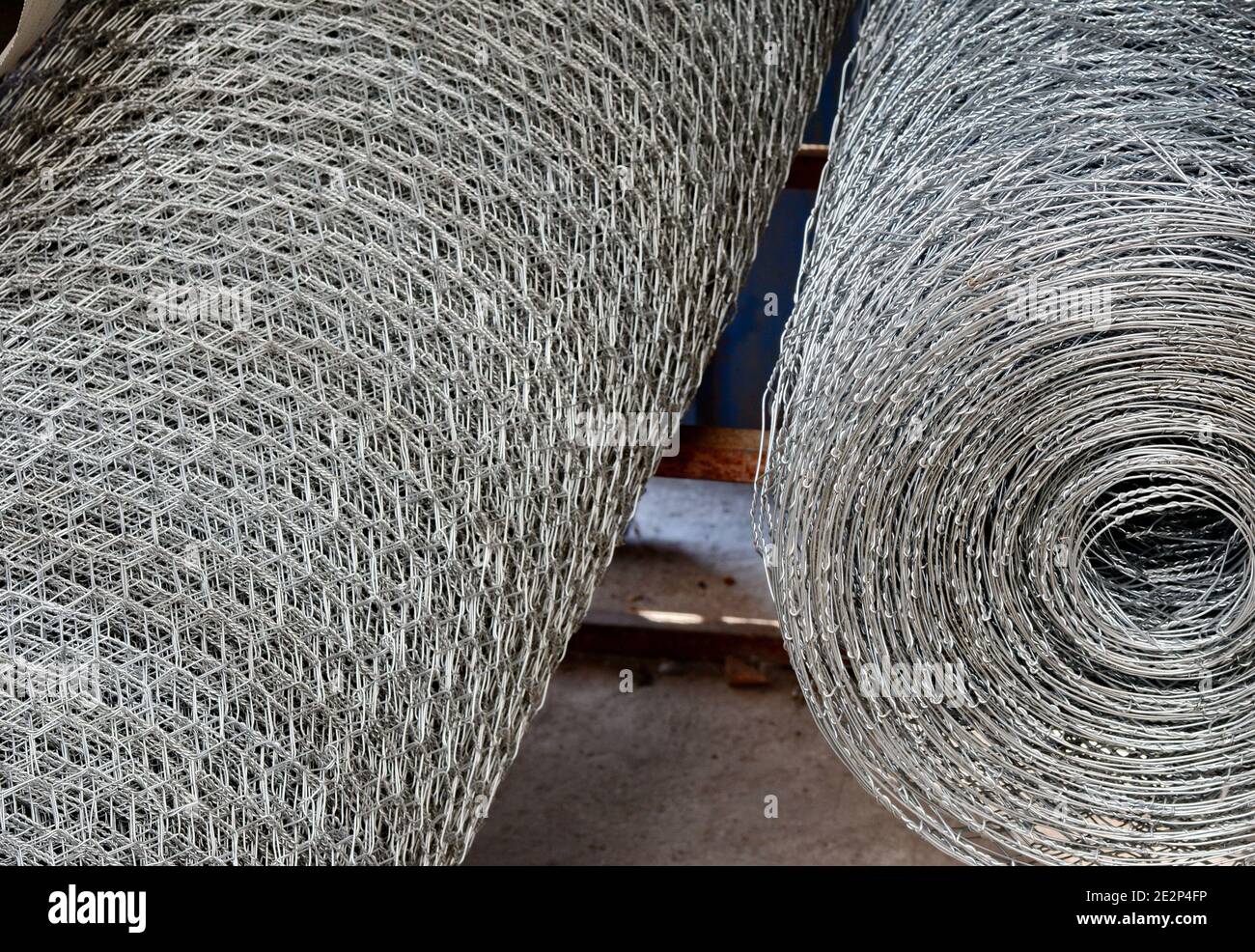 roll of metallic net. Rolls of metal wire fence different heights Stock ...