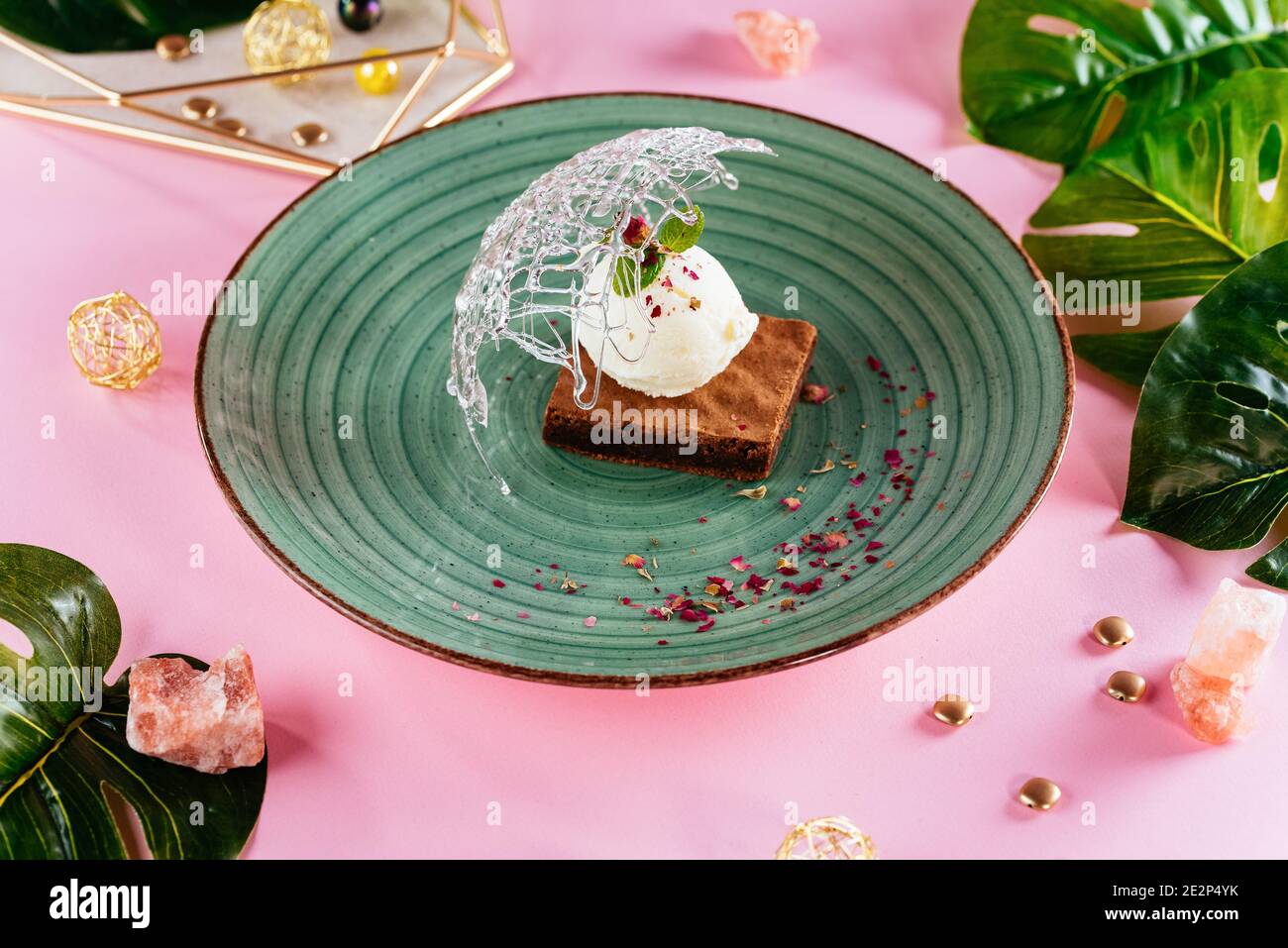 sweet dessert with a ball of ice cream on a pink background with ...