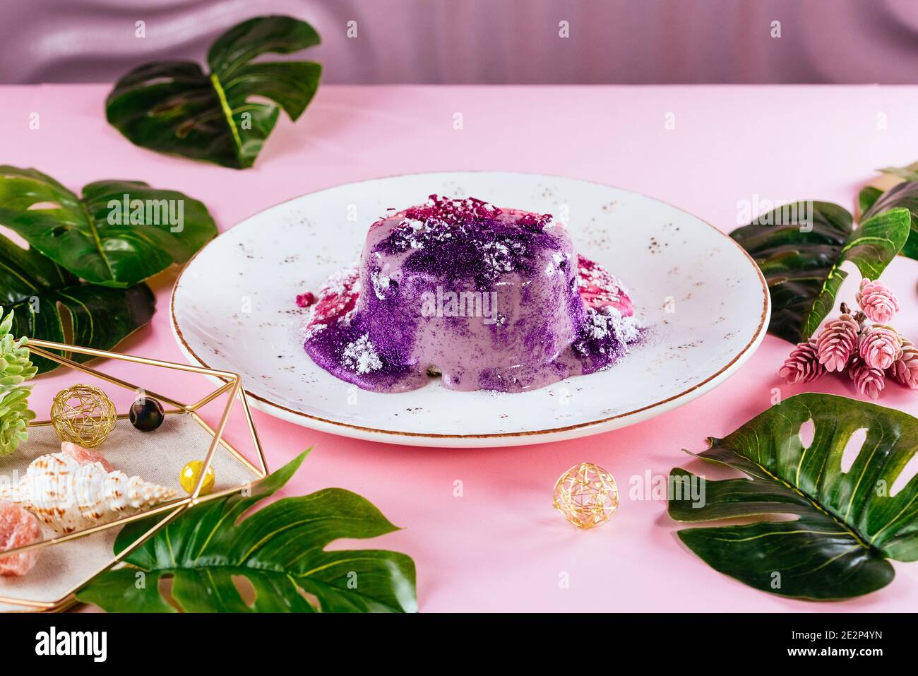 sweet dessert with a ball of ice cream on a pink background with ...