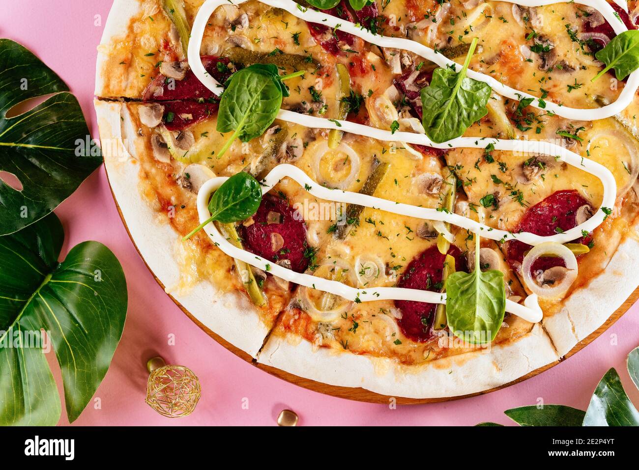 italian pizza on thin dough, pink background with tropical leaves Stock ...