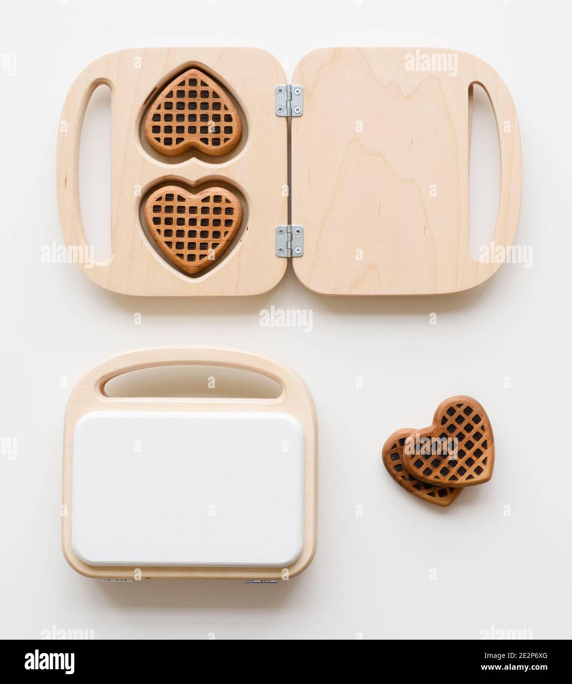 Wooden toy waffle makers and chocolate waffles. Waldorf toys on white ...