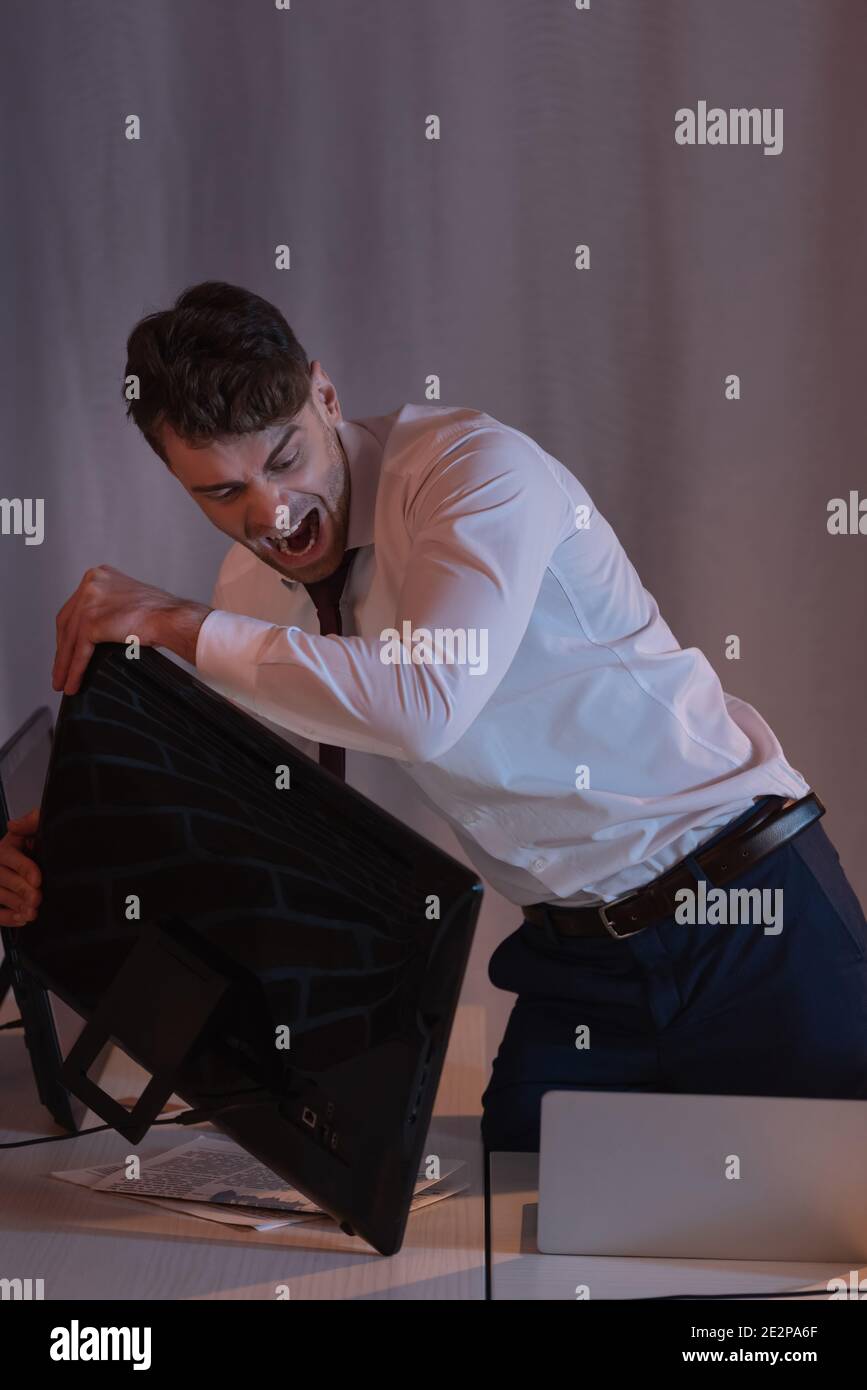 Angry businessman throwing in office hi-res stock photography and ...