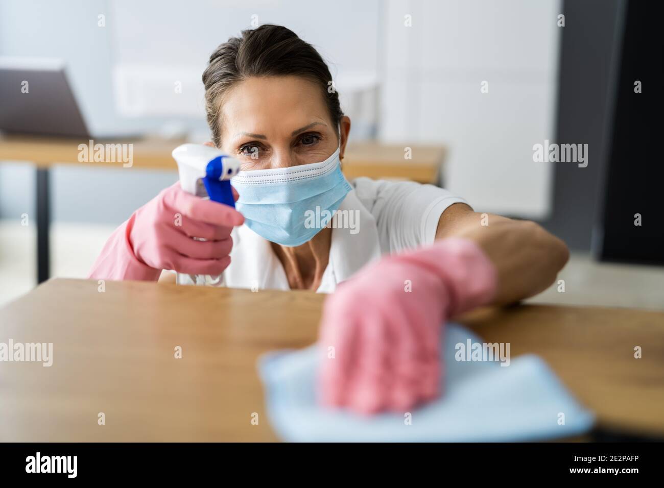 Office Desk Cleaning Service. Professional Janitor In Face Mask Stock ...