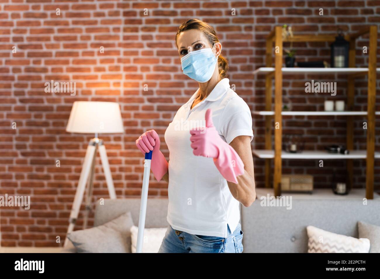 Female janitor mask gloves hi-res stock photography and images - Alamy