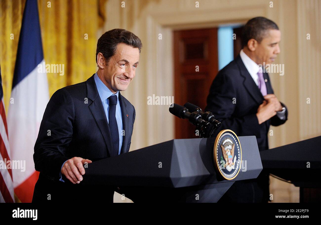 U.S. President Barack Obama and French President Nicolas Sarkozy hold a ...
