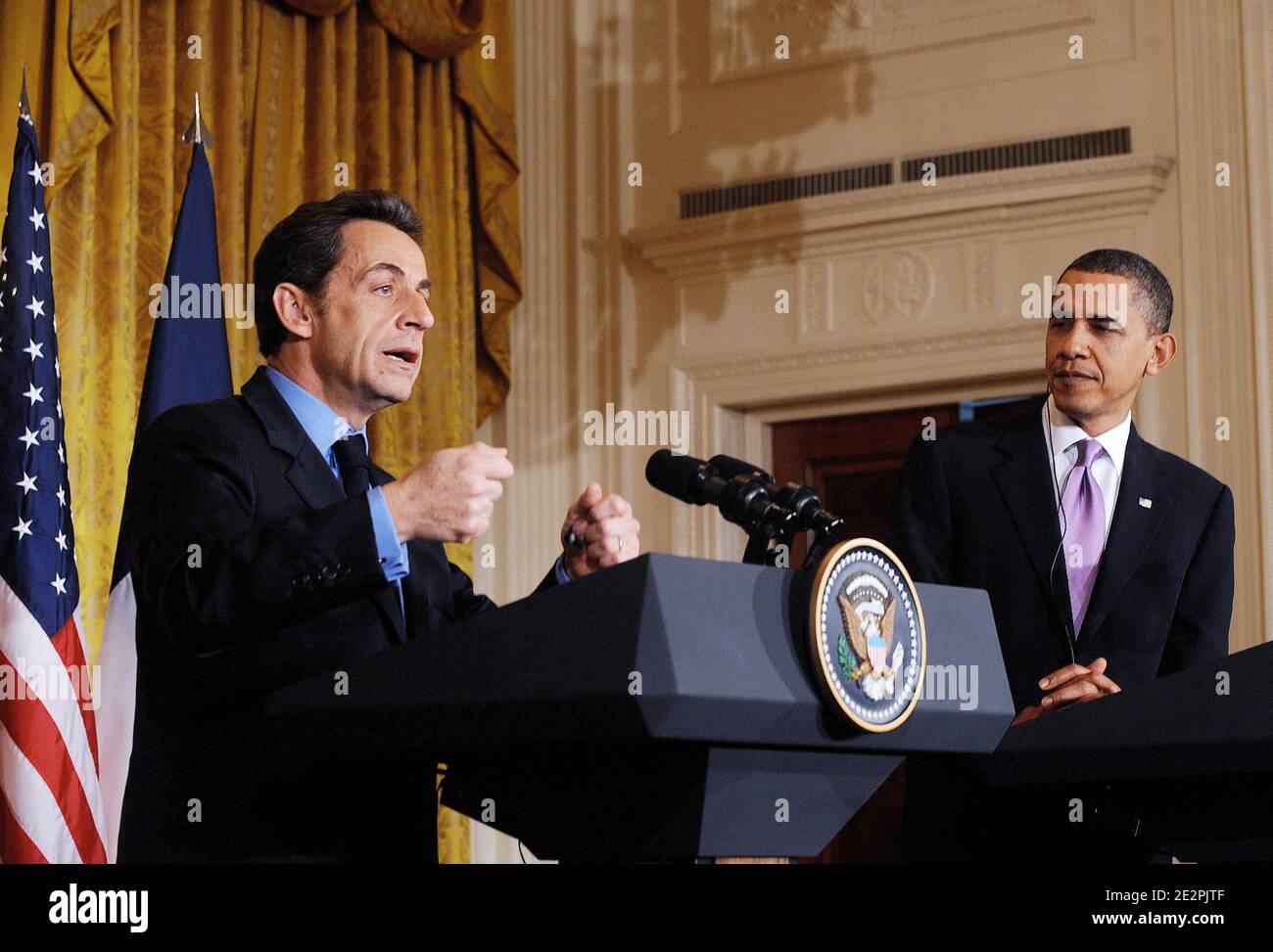 U.S. President Barack Obama and French President Nicolas Sarkozy hold a ...
