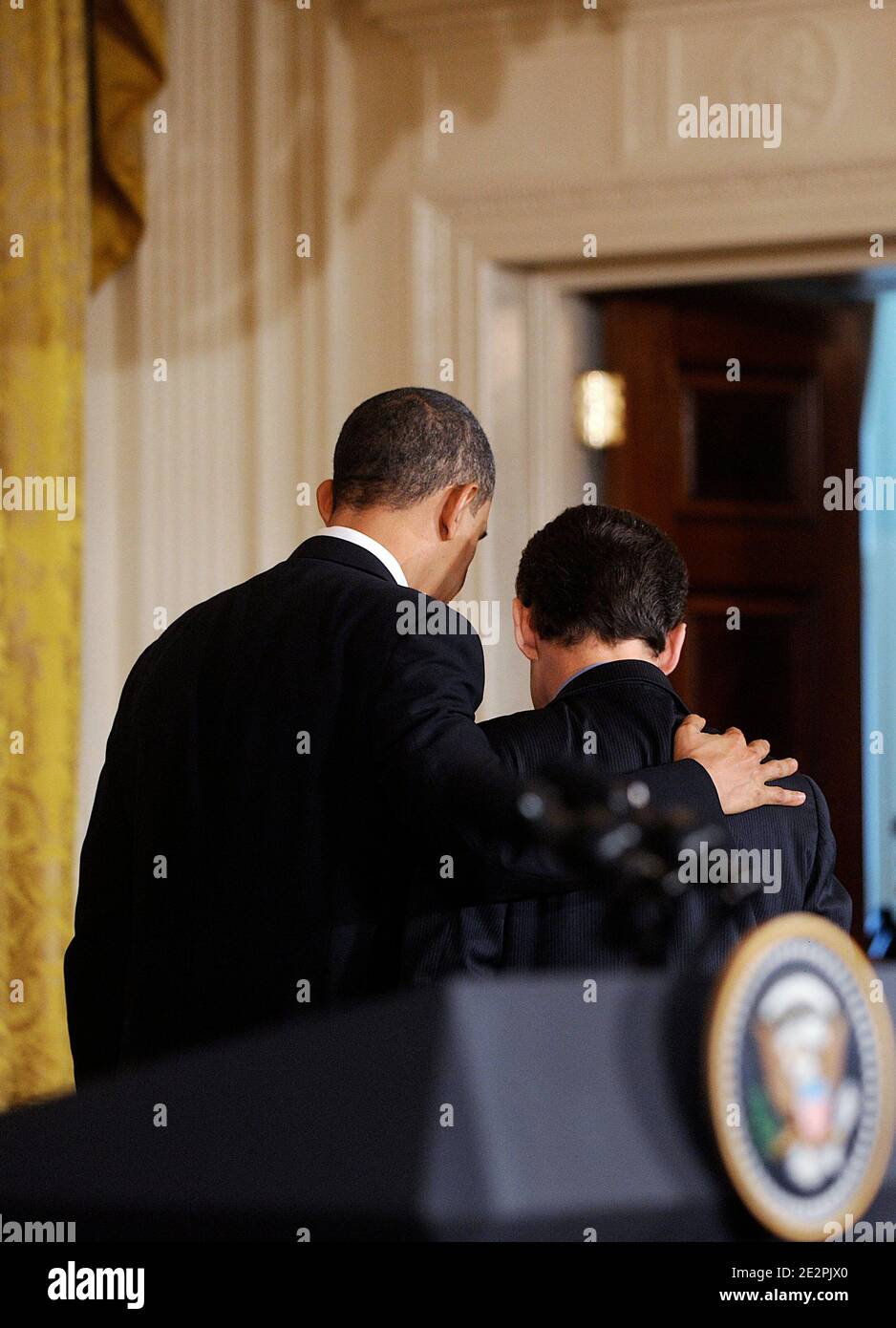 U.S. President Barack Obama and French President Nicolas Sarkozy hold a ...