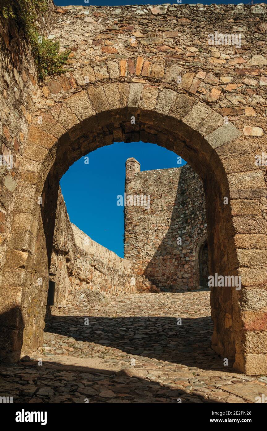 Stone gateway in the internal wall over sidewalk at the Marvao Castle ...