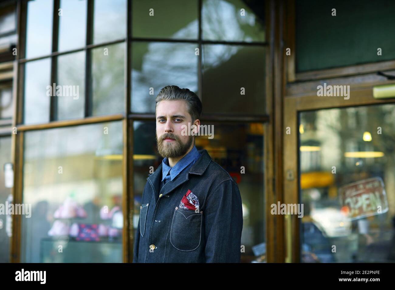 bearded man standing outside a cafe Stock Photo - Alamy