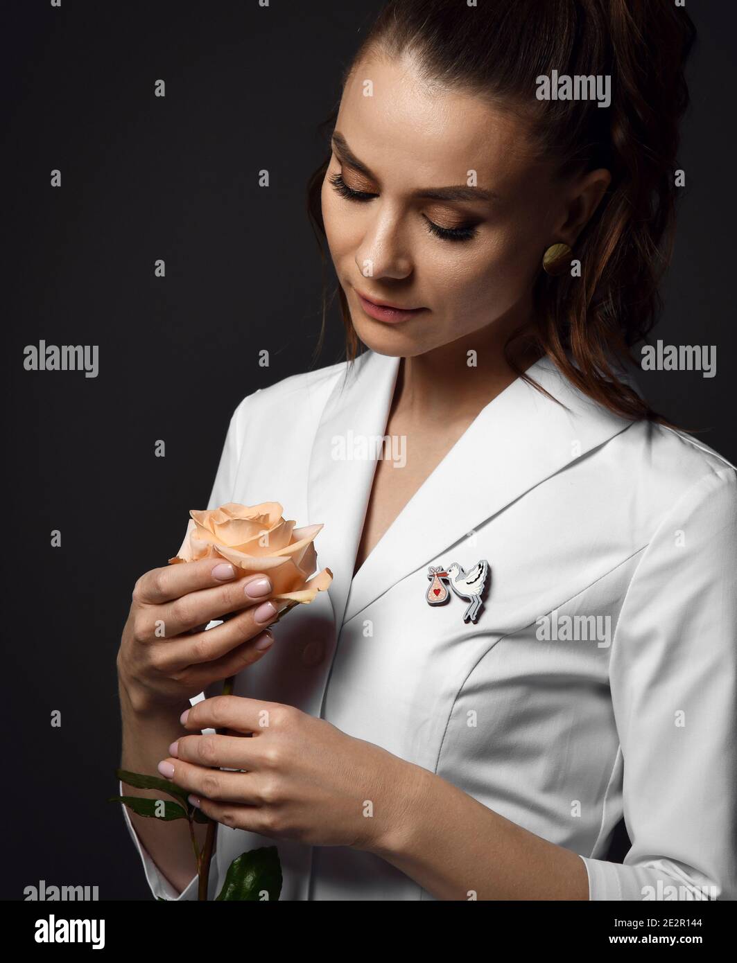 Portrait of pretty woman doctor gynecologist or nurse in white medical ...