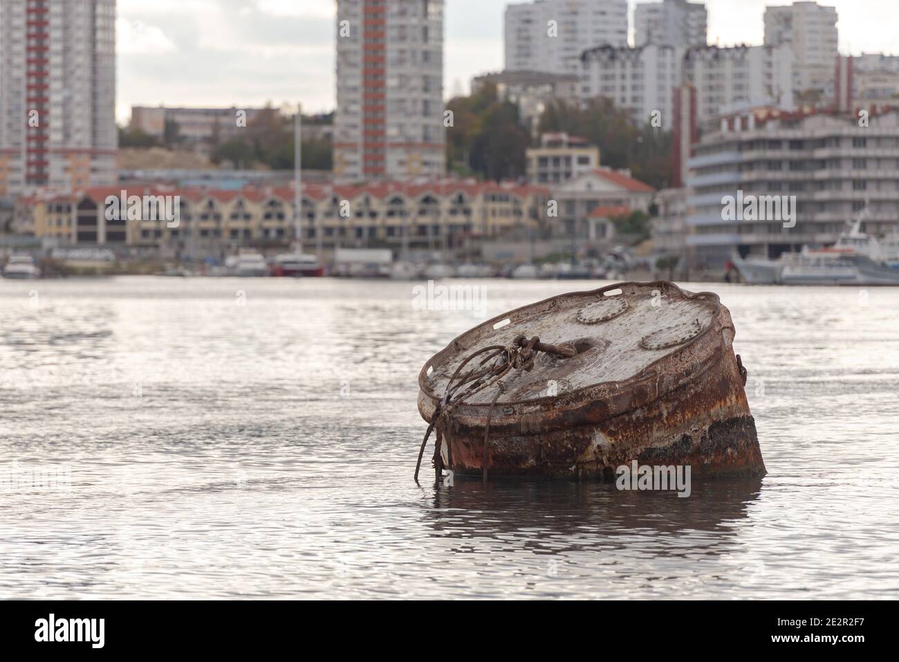 Raid barrel in the bay. A large metal barrel for mooring the ship Stock ...