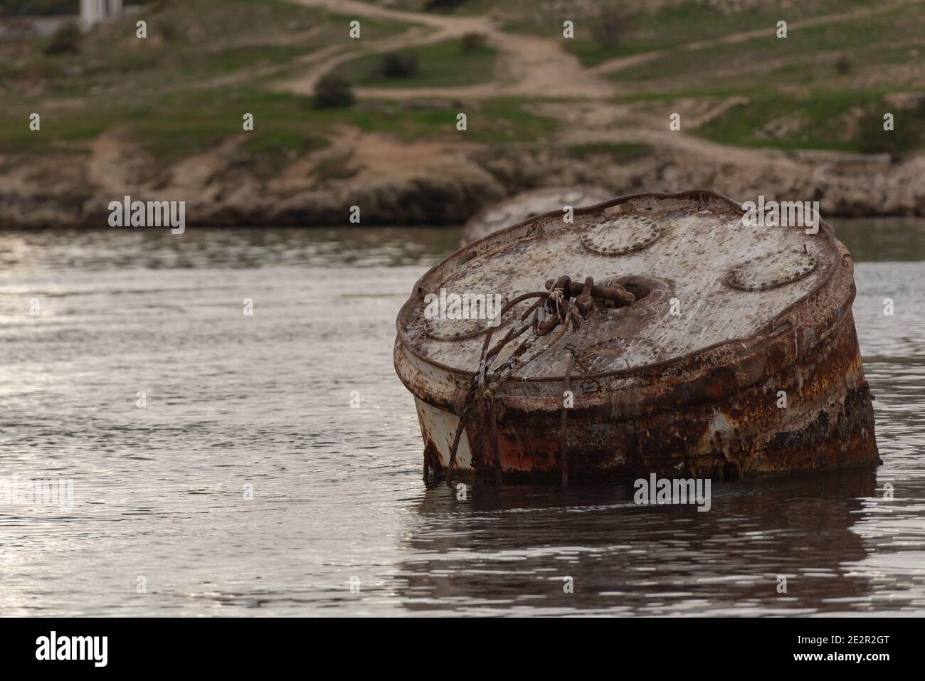 Raid barrel in the bay. A large metal barrel for mooring the ship Stock ...