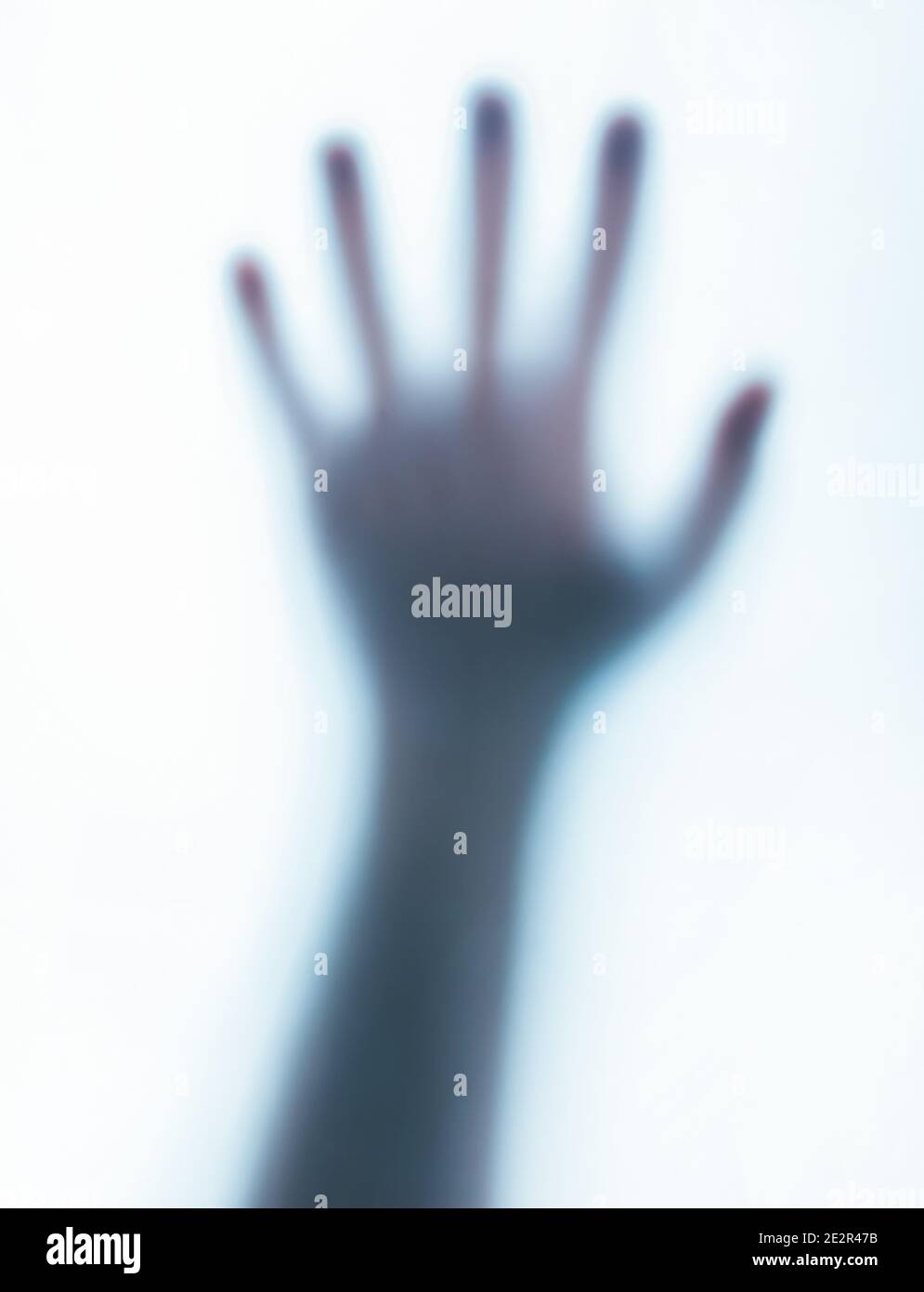 Photo of a blurred paranormal human ghost hand on white background ...