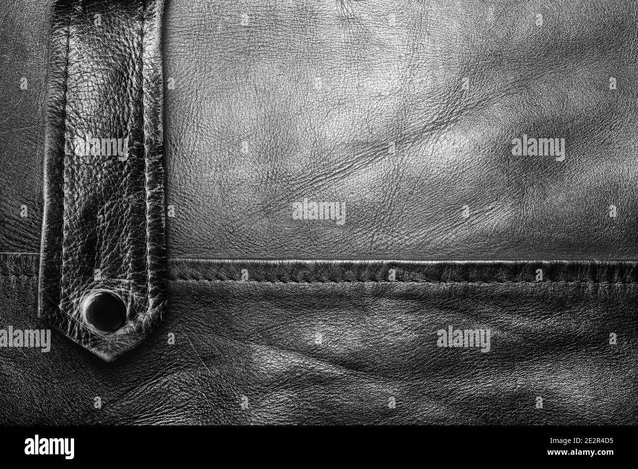 Background photo of a black leather texture with seam and button strap ...