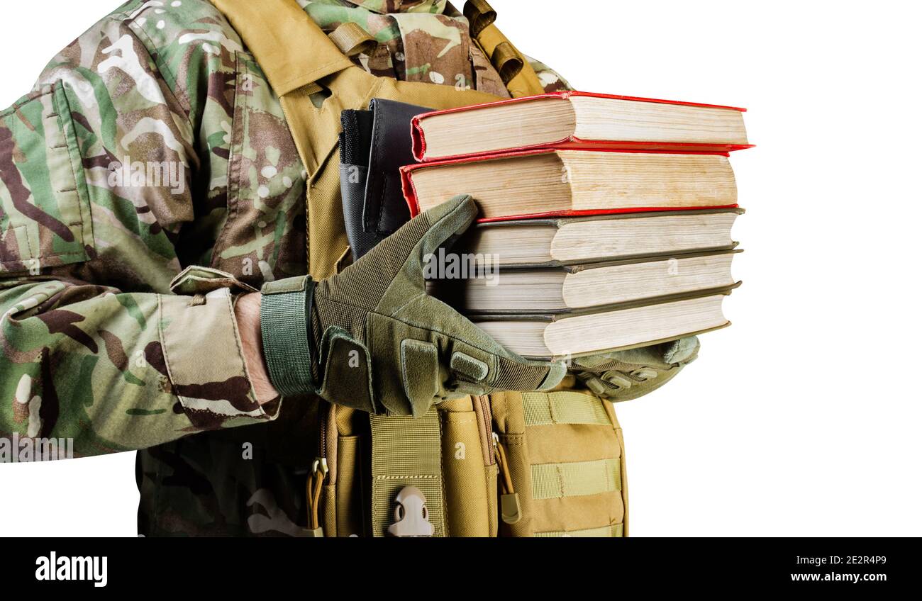 Isolated photo of a soldier in uniform holding stack of books on white ...
