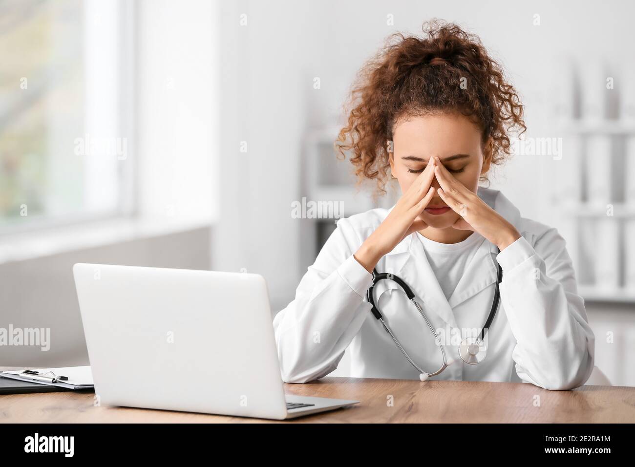 Stressed female doctor hi-res stock photography and images - Alamy
