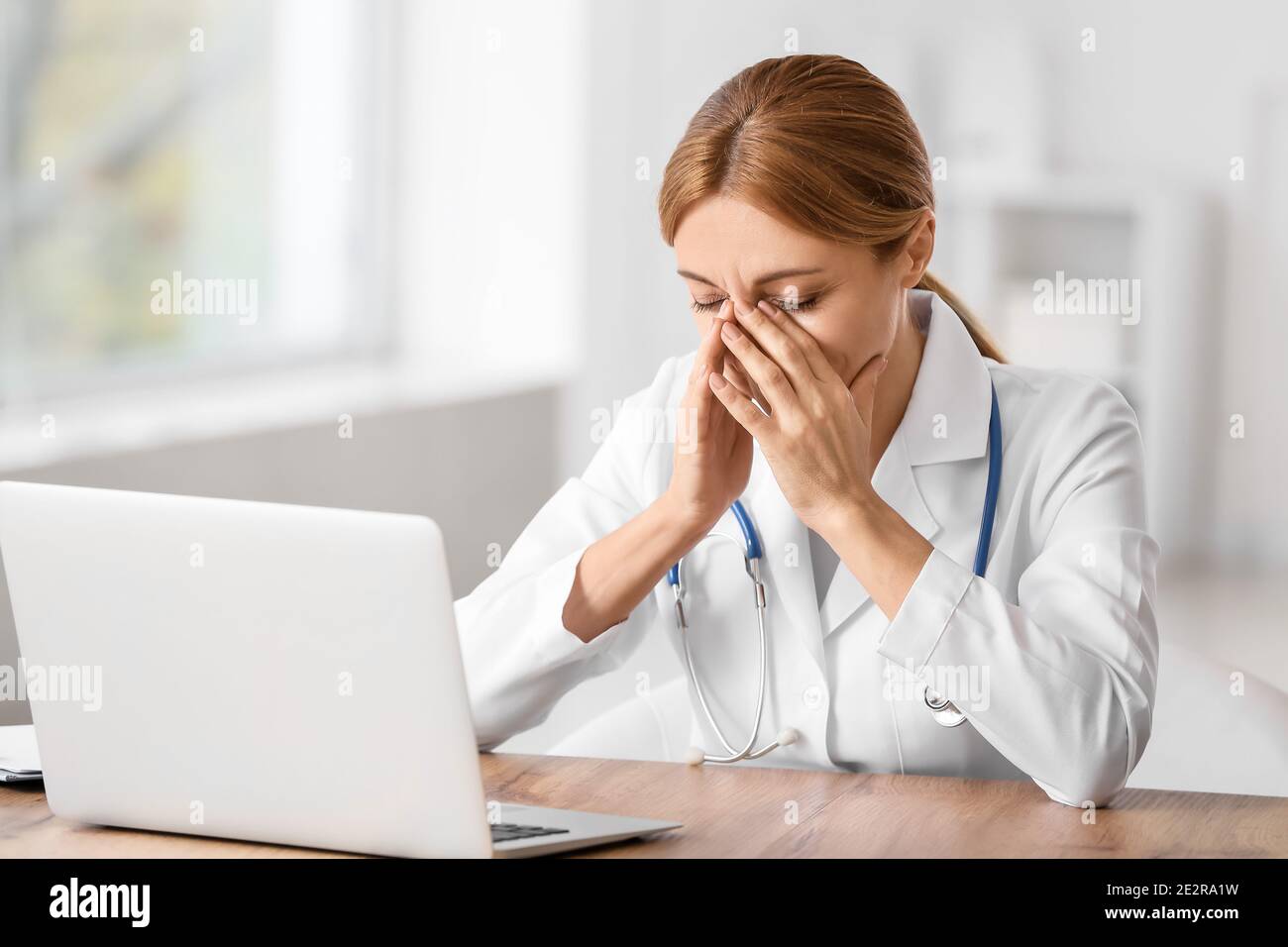 Stressed female doctor hi-res stock photography and images - Alamy