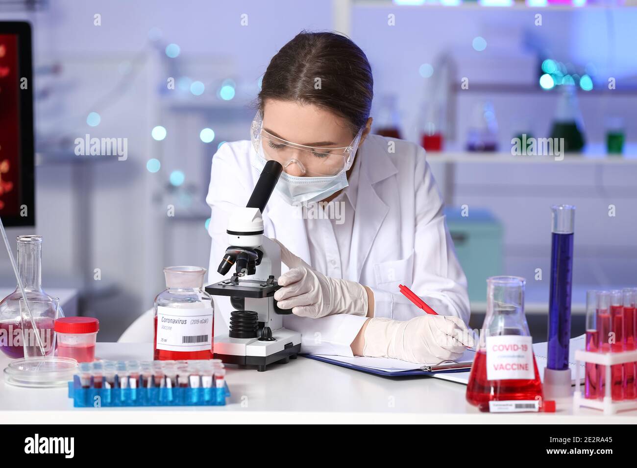 Scientist studying sample in laboratory Stock Photo - Alamy