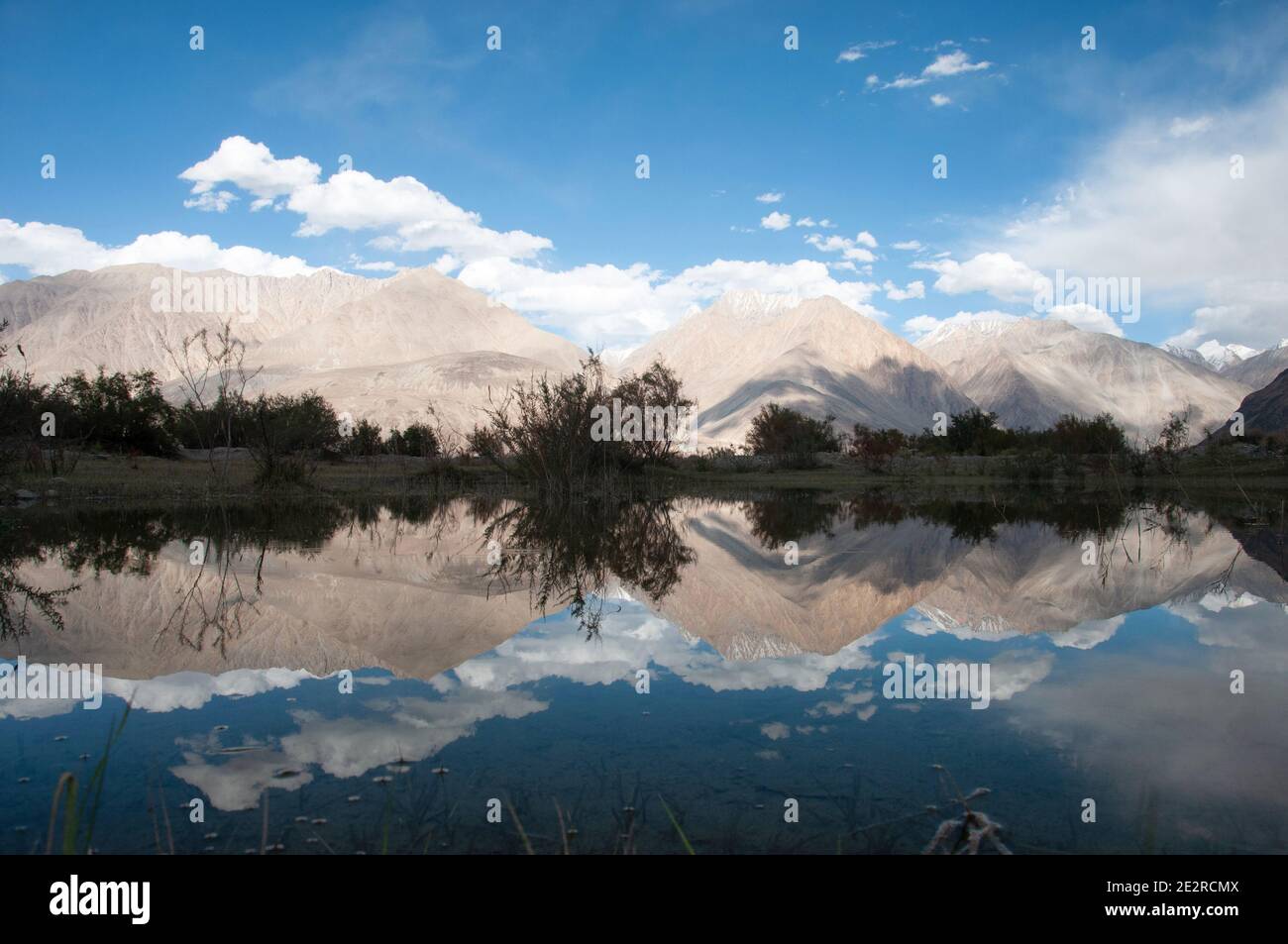Clean reflection of mountains in Nubra Valley, Leh, India Stock Photo ...